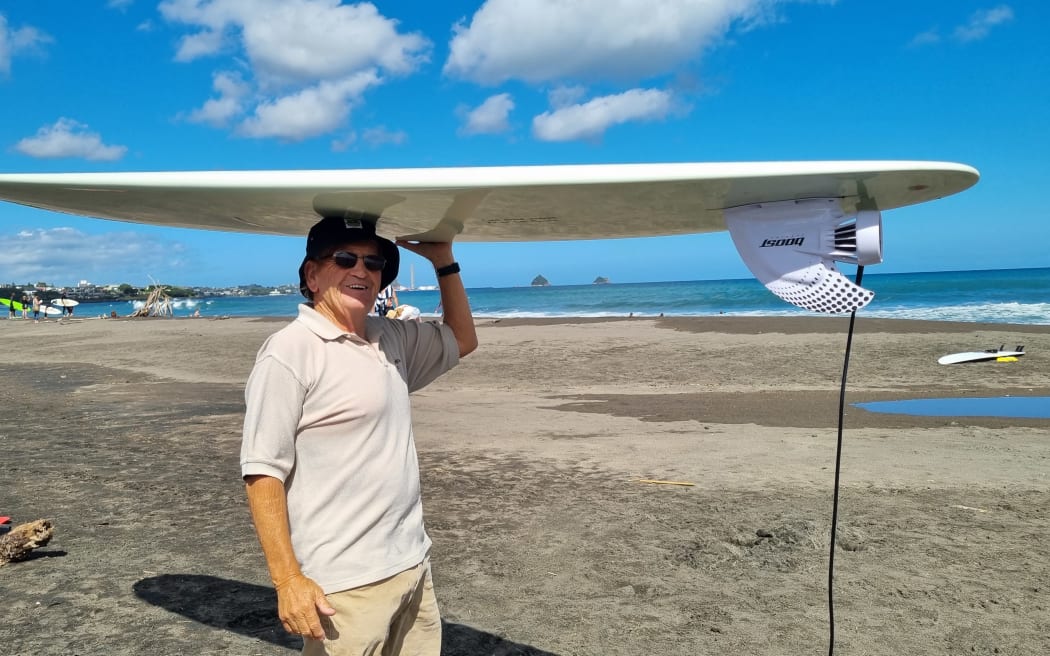 Surfer in his 80s chases 'the stoke' on electric board | RNZ News