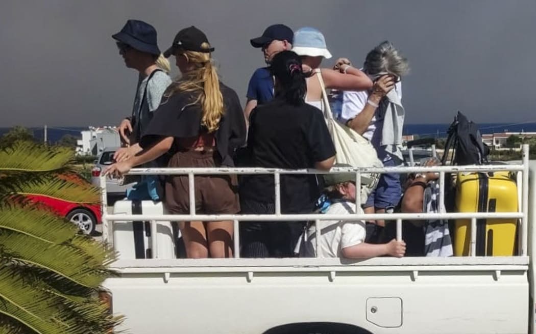 Greece fires: Thousands flee homes and hotels on Rhodes as fires spread ...