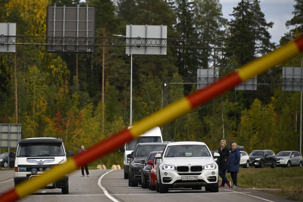 Queues form at Russia's borders after Putin's military mobilisation ...