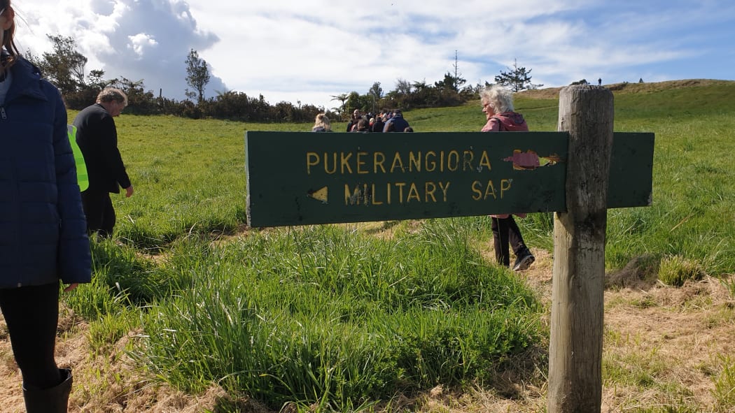 People with metal detectors dig up historically significant ...