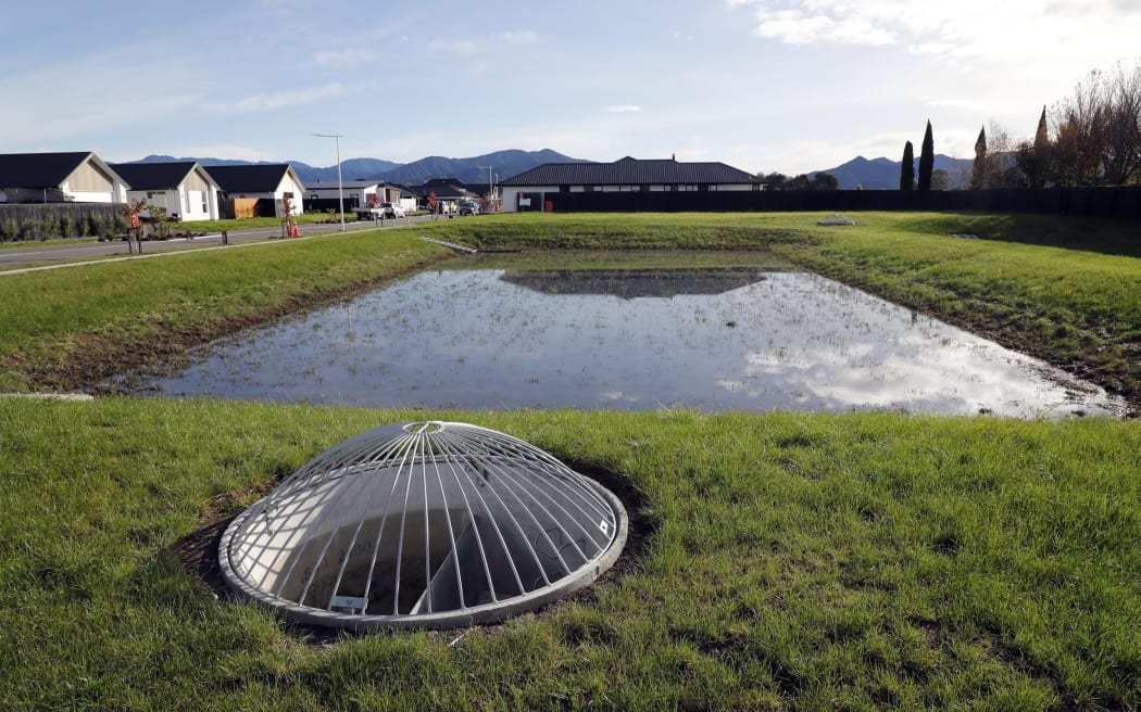 Dad’s drowning fears in flash subdivision as ‘swimming pool’ ponds left ...