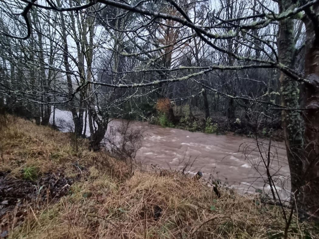 Man charged over death of woman after vehicle swept away in floods ...
