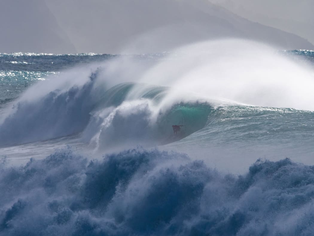 Surfing the massive storm swells on the East Cape | RNZ